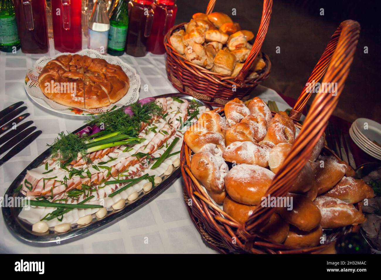 Russian feast. Table set with Russian snacks: pies pirozhki with ...