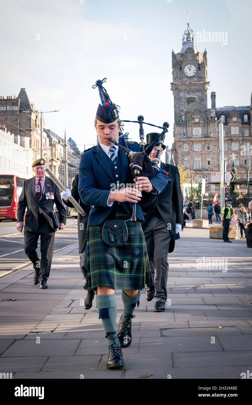 A lone piper leads veterans and military personnel along Princes Street ...