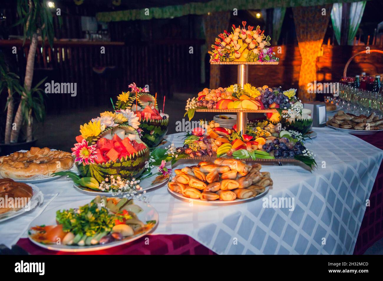 Russian feast. Table set with Russian snacks: pies with stuffing ...