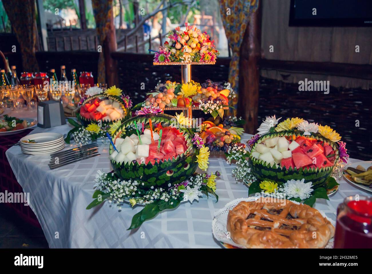 Fruit table with Canape appetizer: carved watermelons filled with ...
