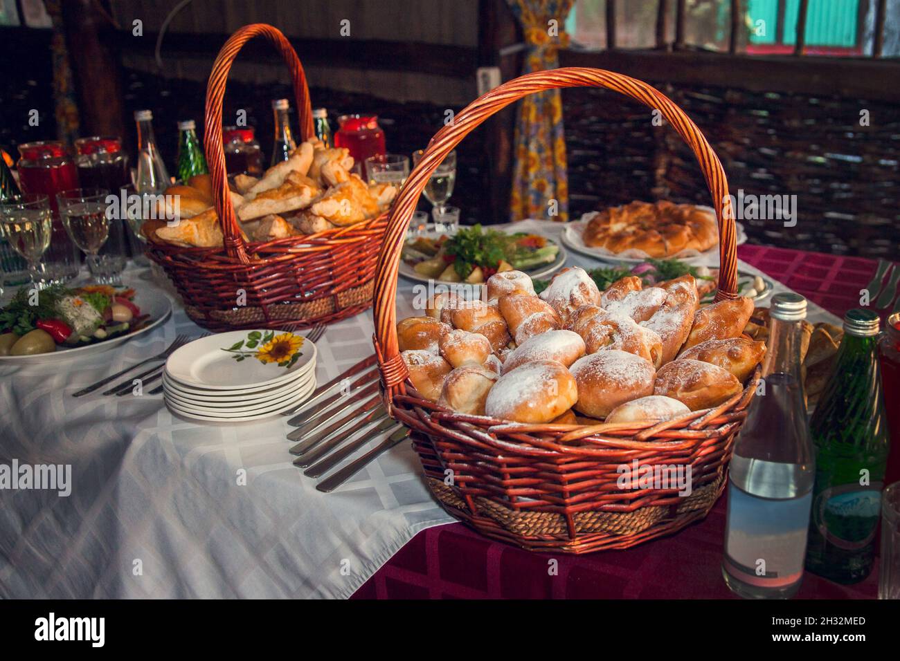 Russian feast. A table set with Russian snacks: stuffed pies pirozhki ...