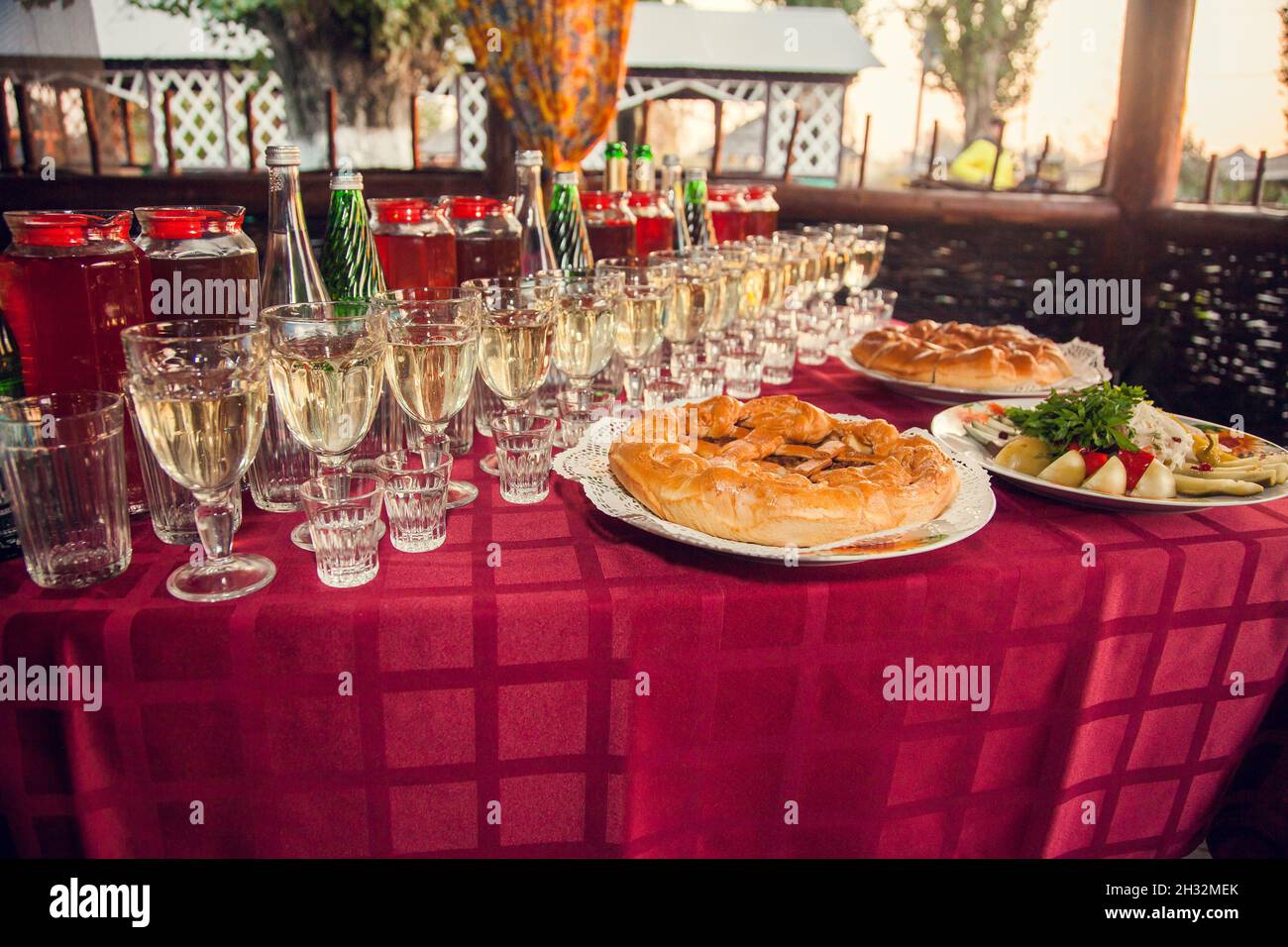 Russian feast. Table set with Russian snacks: pies with stuffing ...