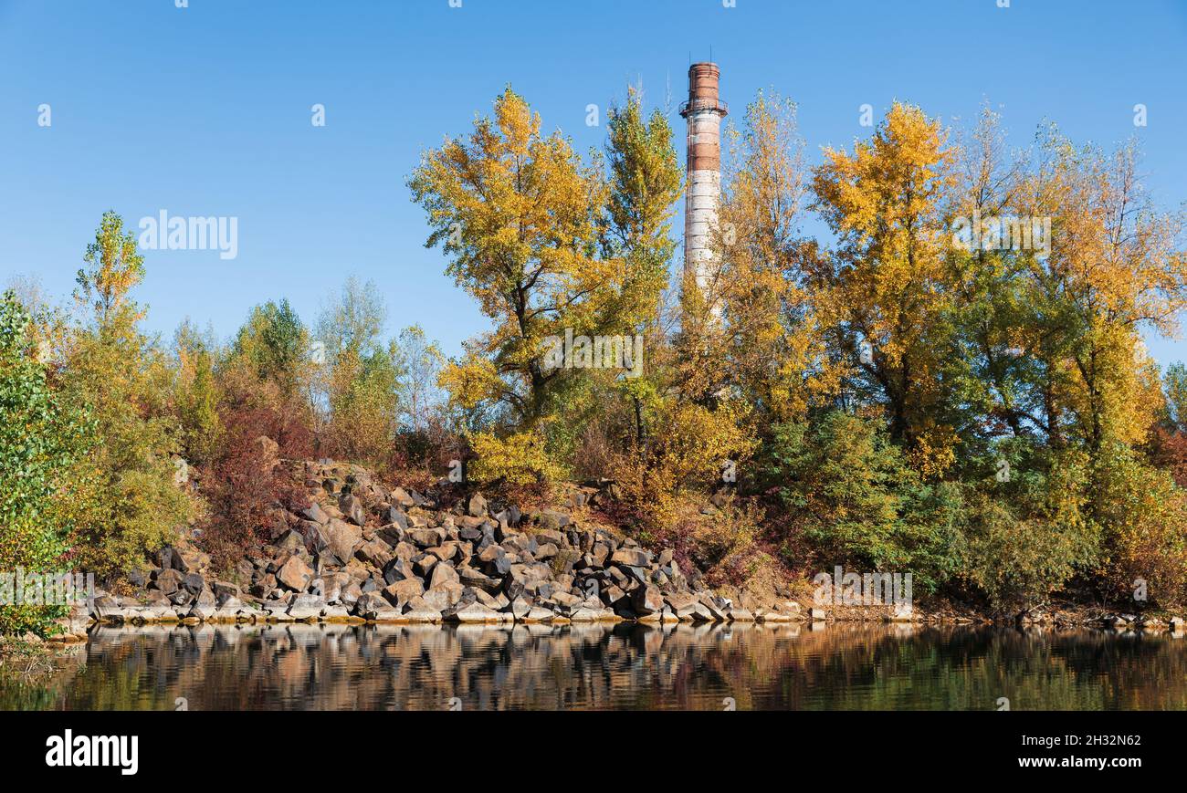 Large brick chimney. Tall factory chimney made of brick against blue ...