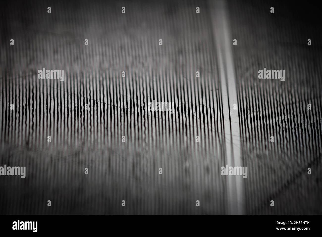 Macro shot of black vinyl record showing scratches. Surface of an old ...