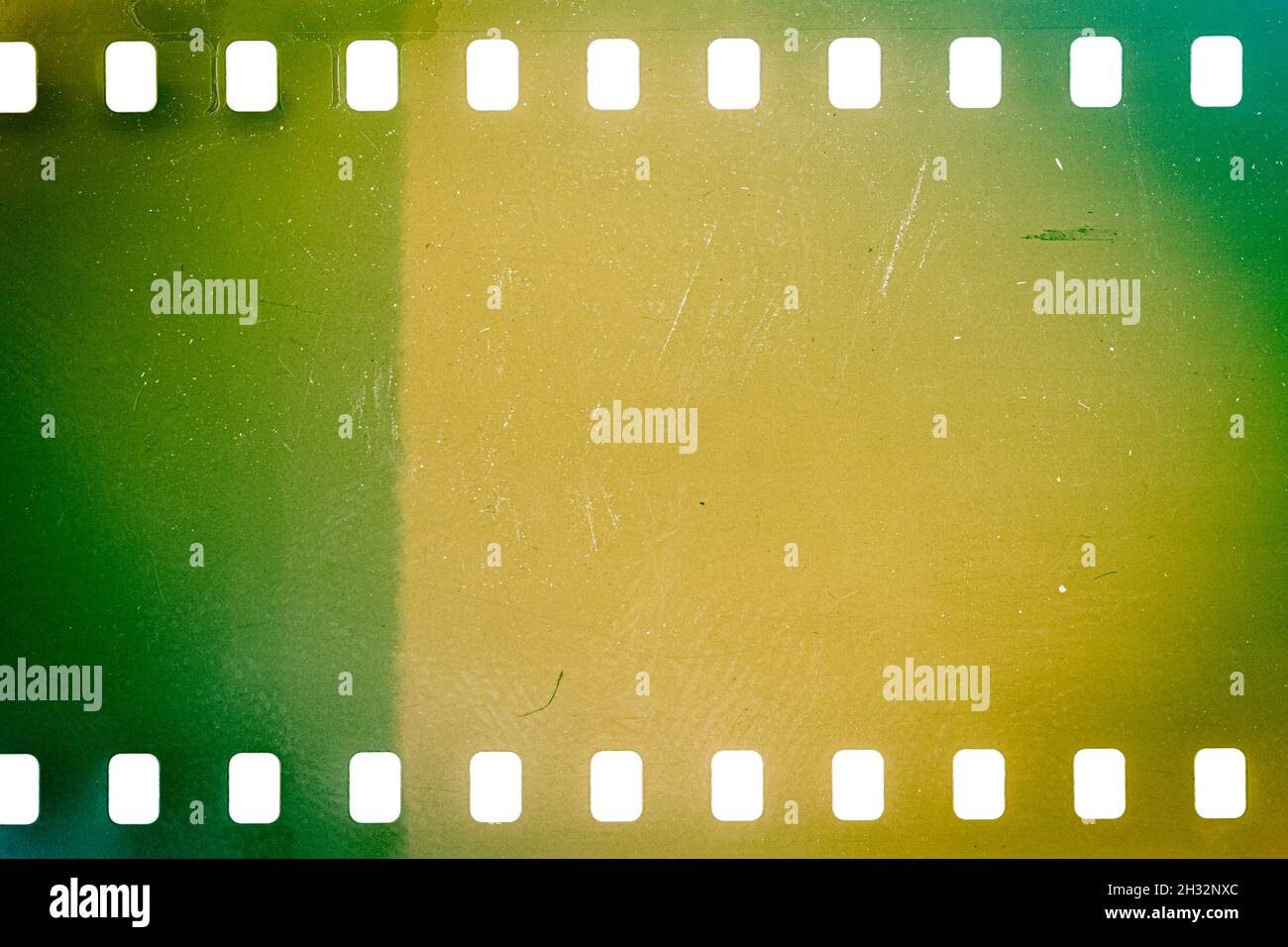 Dusty and grungy 35mm film texture or surface. Perforated camera film ...