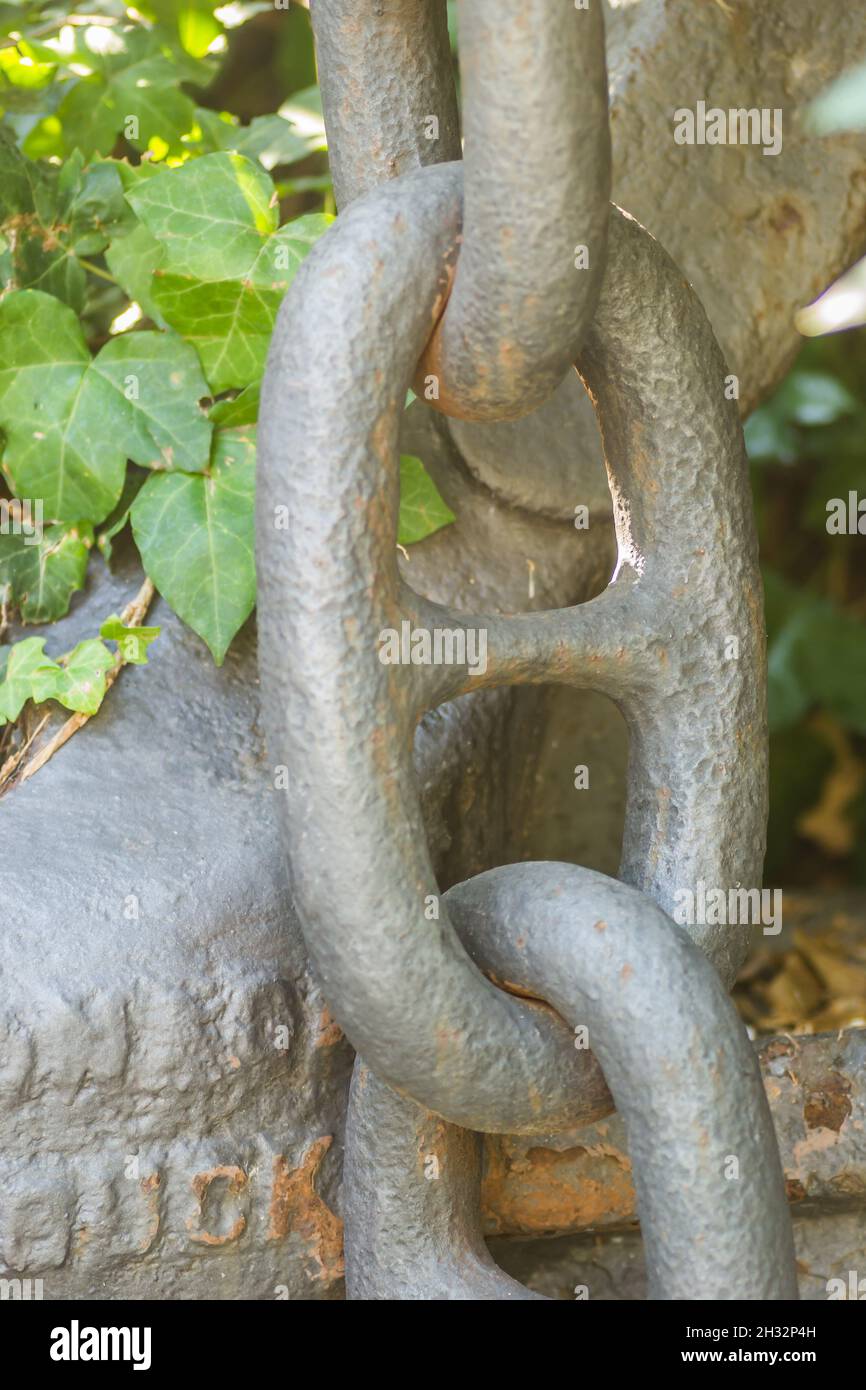 Heavy links of a thick anchor chain - close-up of a museum space in the ...