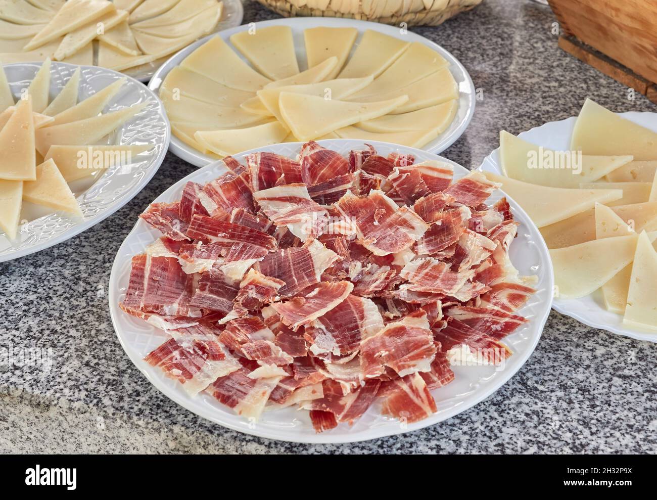 Top view of fresh ham slices and cheese plates on a table Stock Photo ...