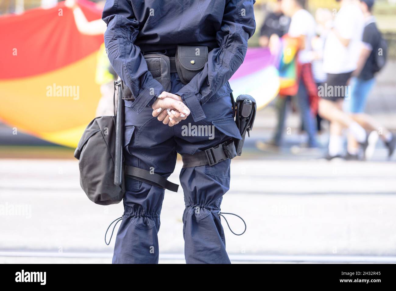 Female police officer on duty during LGBT parade Stock Photo - Alamy