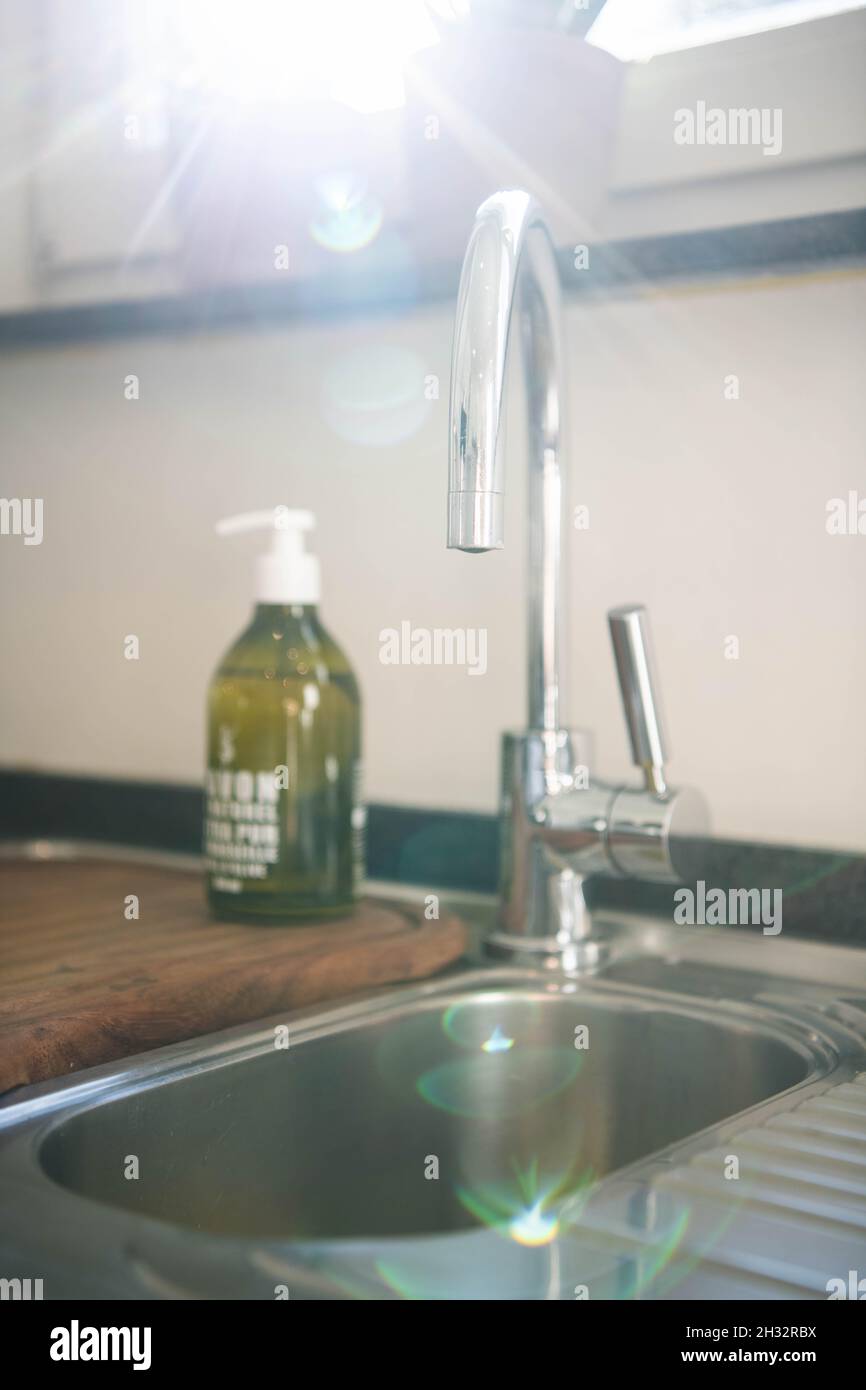 A kitchen tap in the sun Stock Photo - Alamy