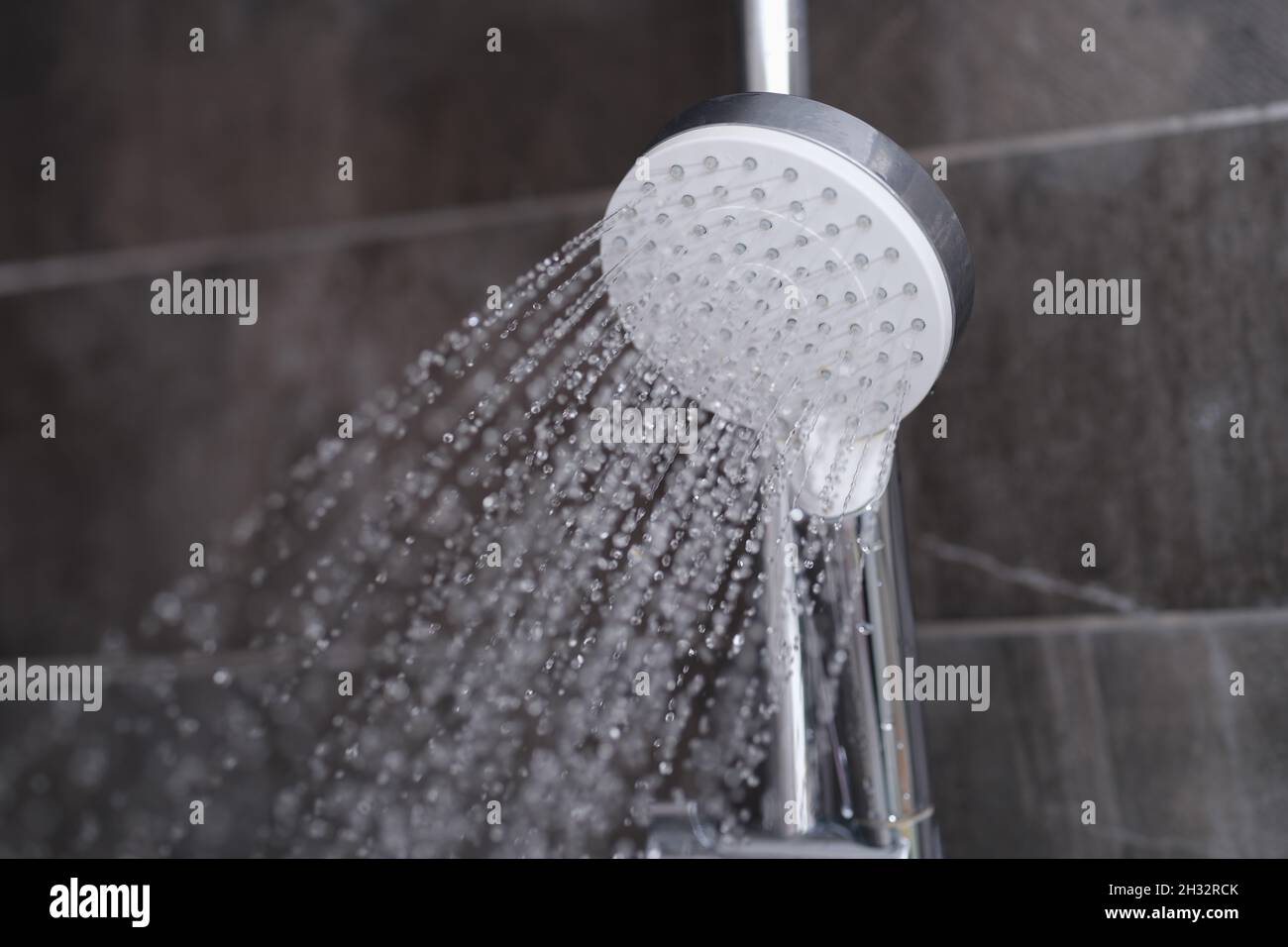 Splashing water from the mixer in the bathroom for a shower Stock Photo ...