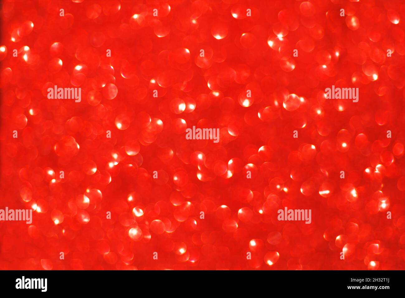 Defocused christmas red glitter background with bokeh. Holiday glowing ...