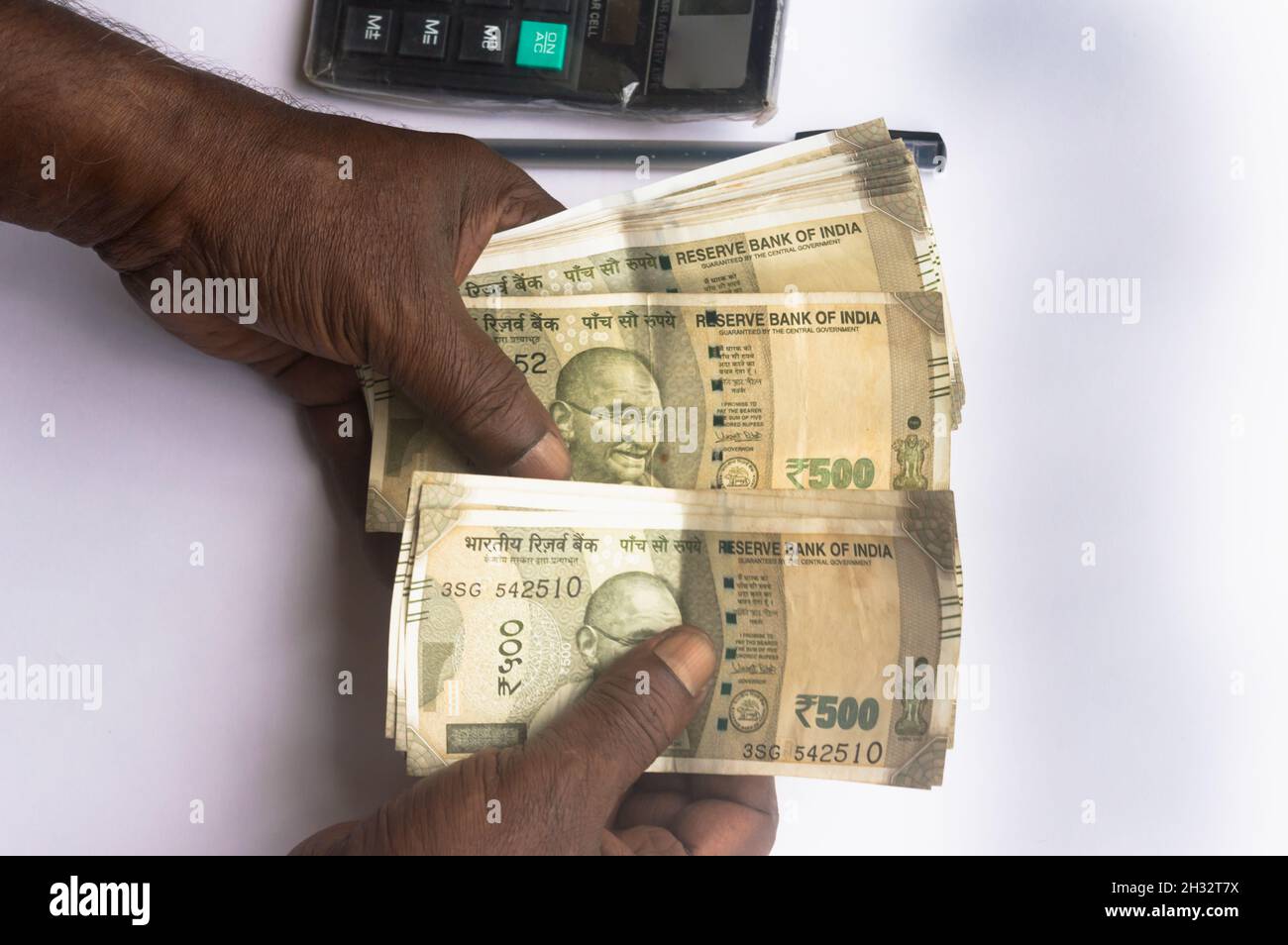 Business Man hand counting Indian rupee note on table. High angle view ...