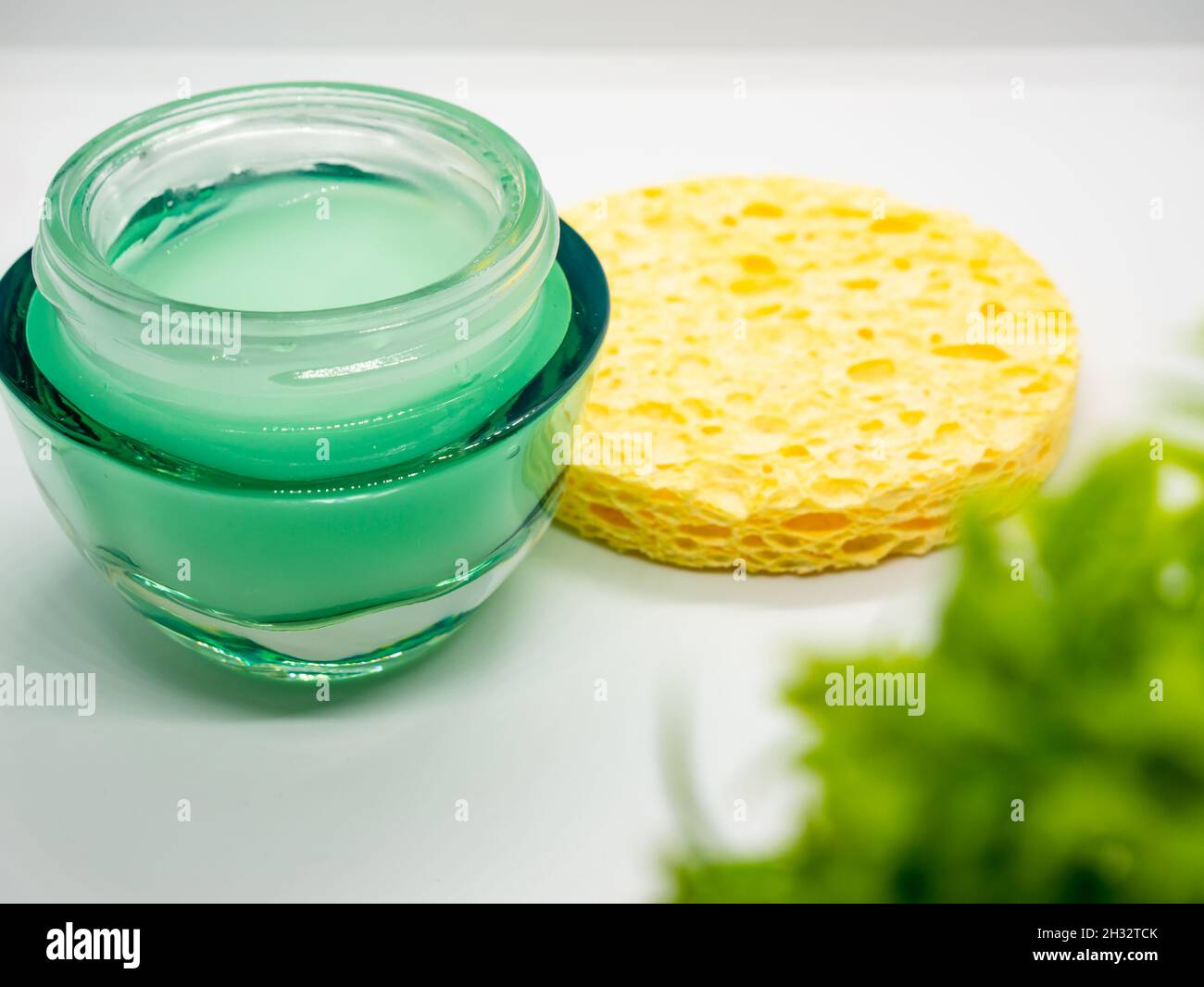 spa related objects on white background, Green Body cream and yellow ...