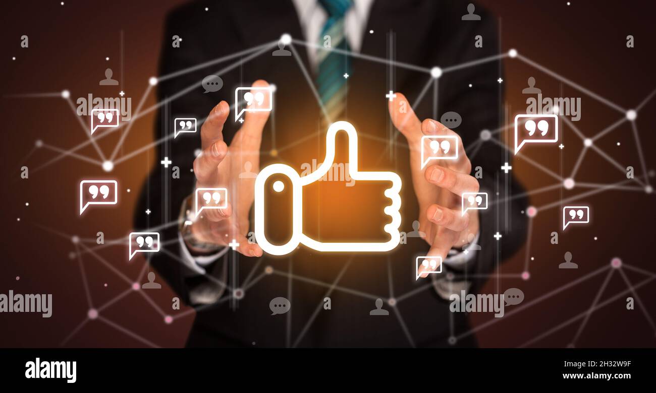 Hand holding social media icons Stock Photo - Alamy