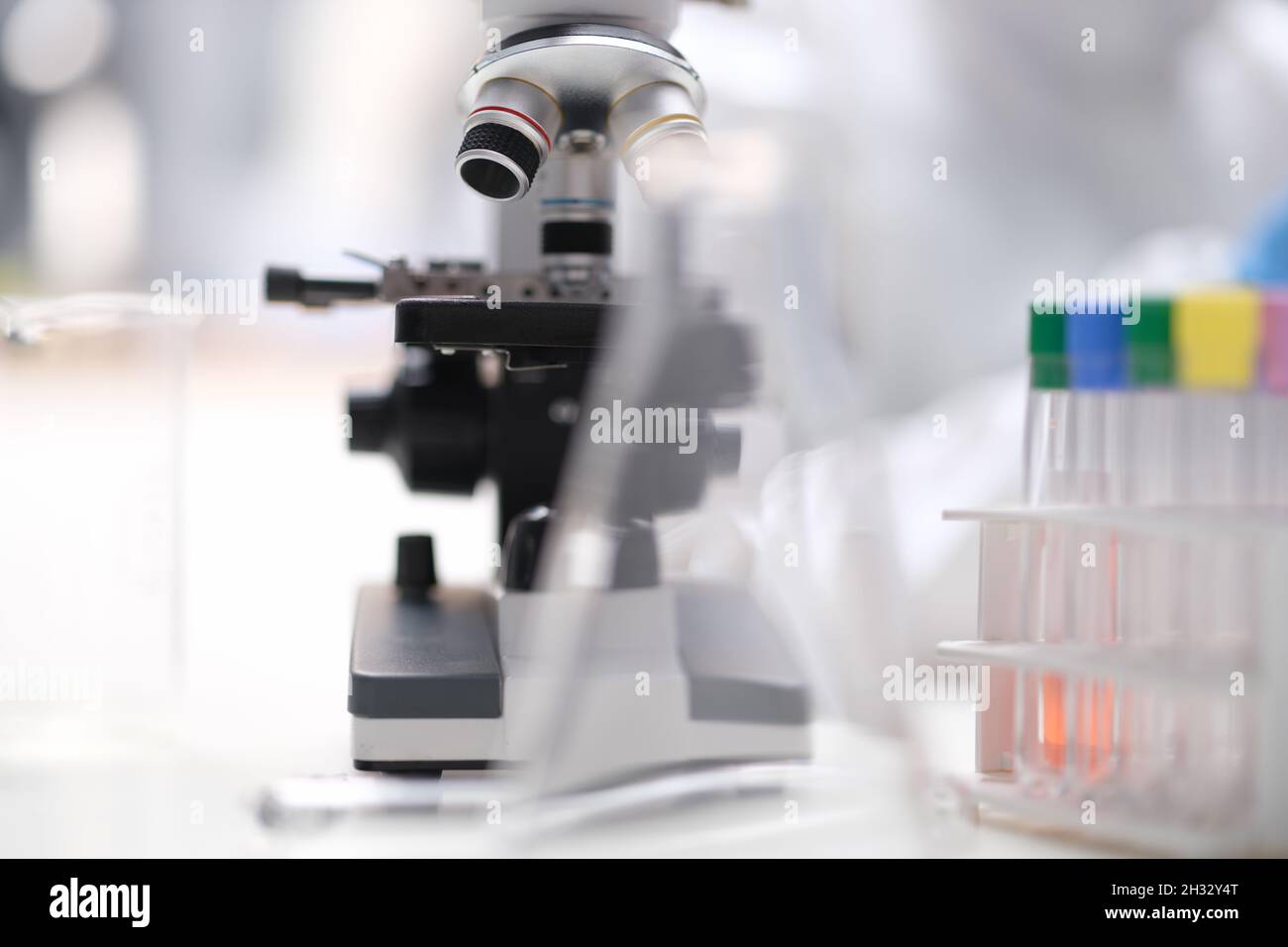 Laboratory, on the table a microscope and beakers Stock Photo - Alamy