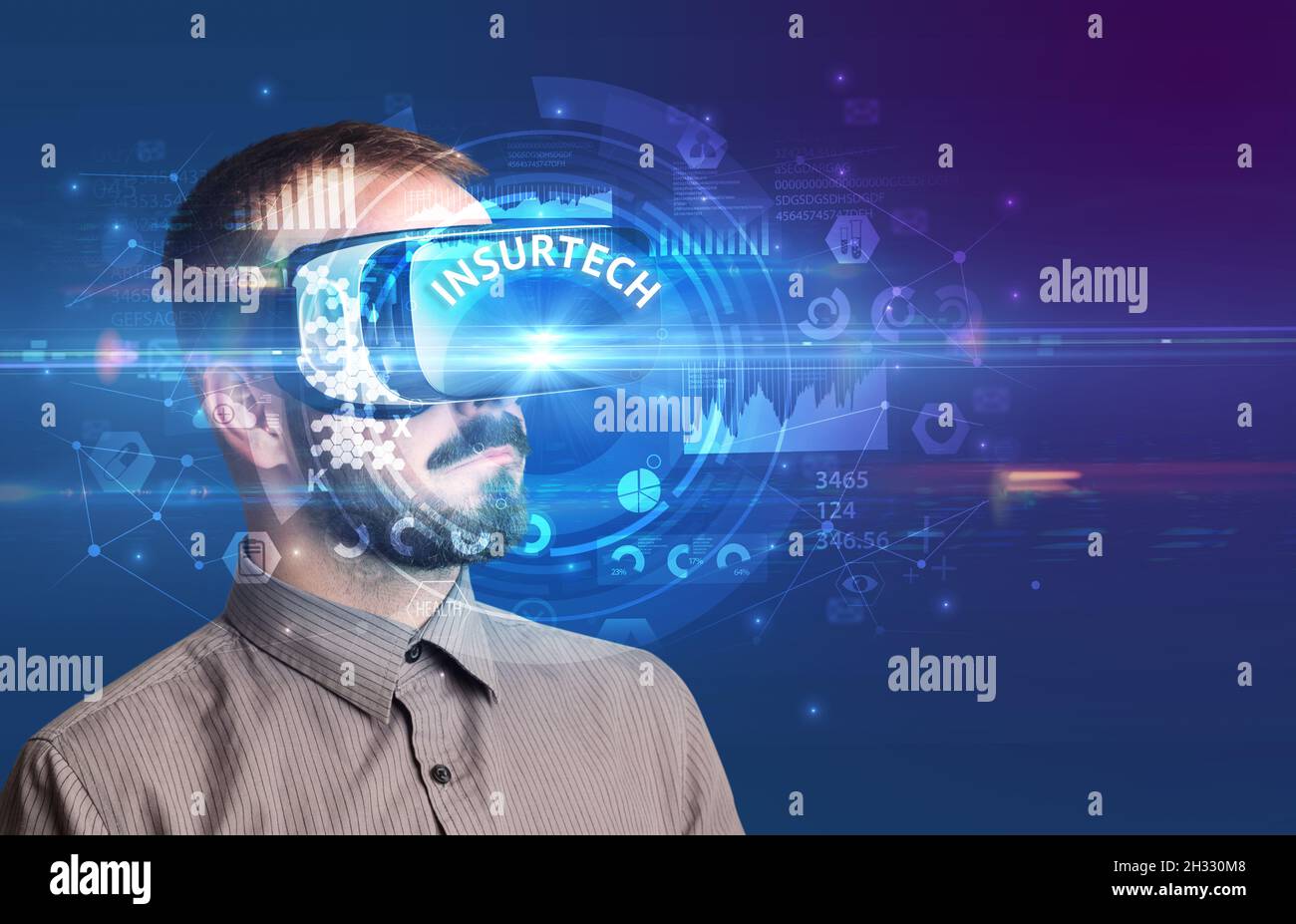 Businessman looking through VR glasses Stock Photo - Alamy