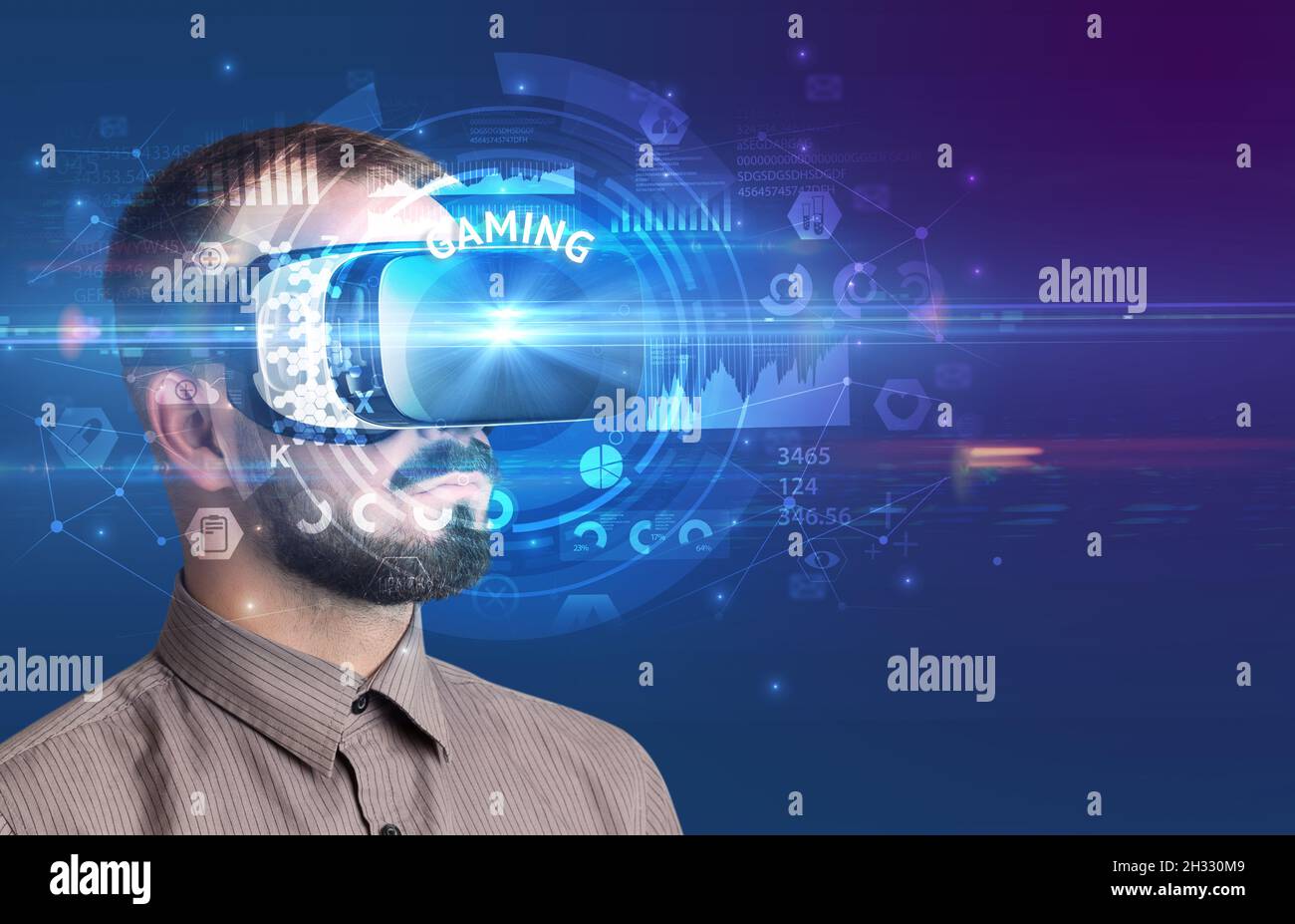 Businessman looking through VR glasses Stock Photo - Alamy