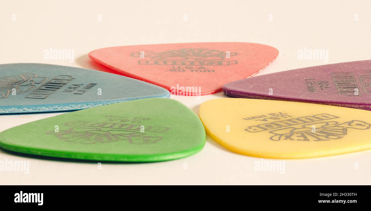 Circle of rainbow coloured guitar plectrums Stock Photo - Alamy