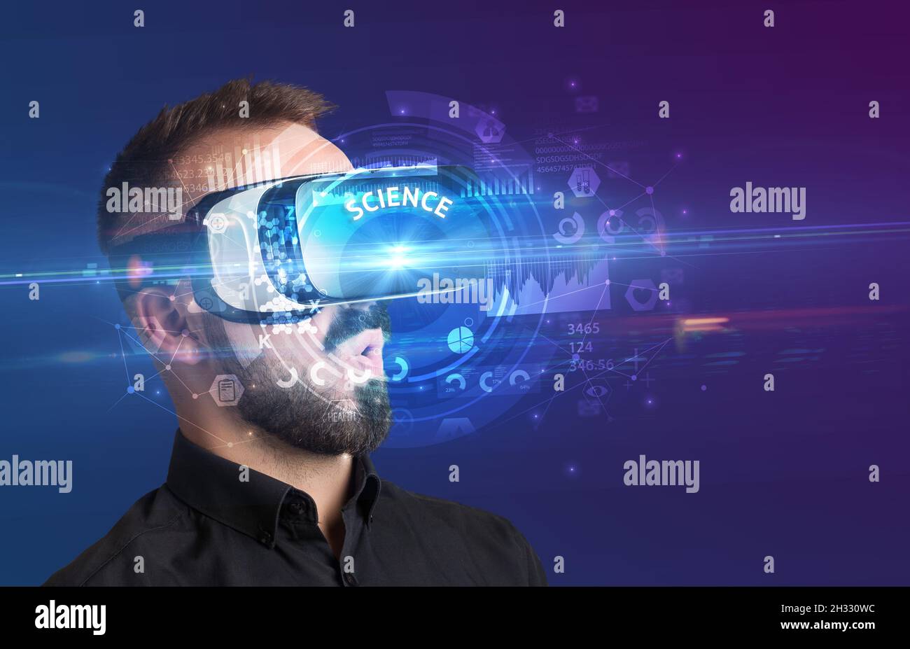 Businessman looking through VR glasses Stock Photo - Alamy