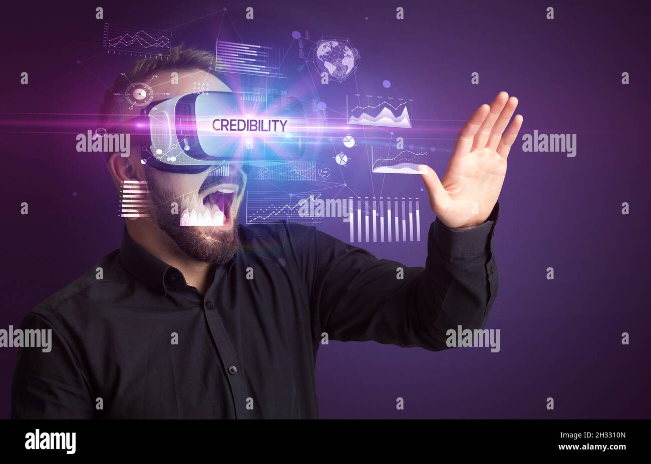 Businessman looking through Virtual Reality glasses Stock Photo - Alamy