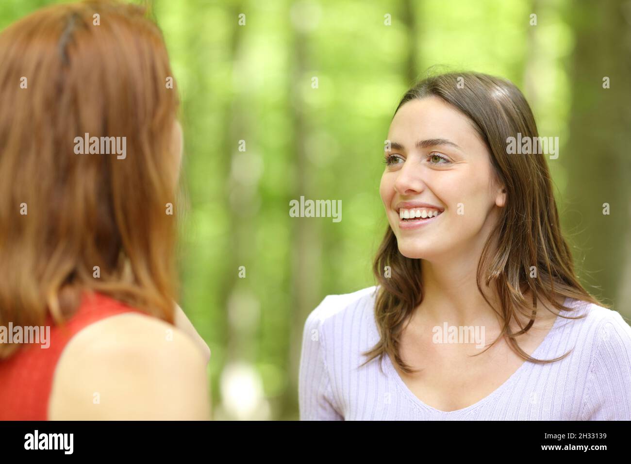 Two people facing each other talking hi-res stock photography and ...