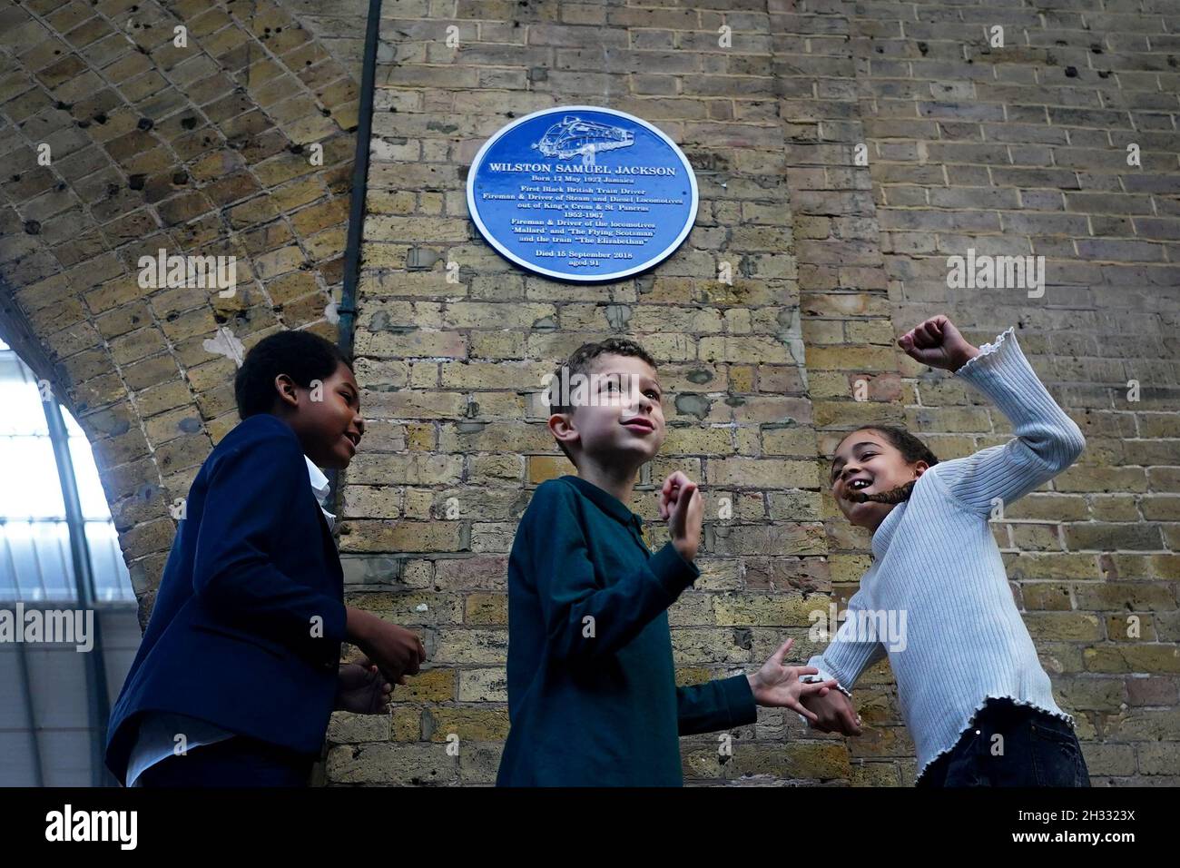 Josiah Jackson, Lawrence Hollingsworth and Sofia Hollingsworth stand ...
