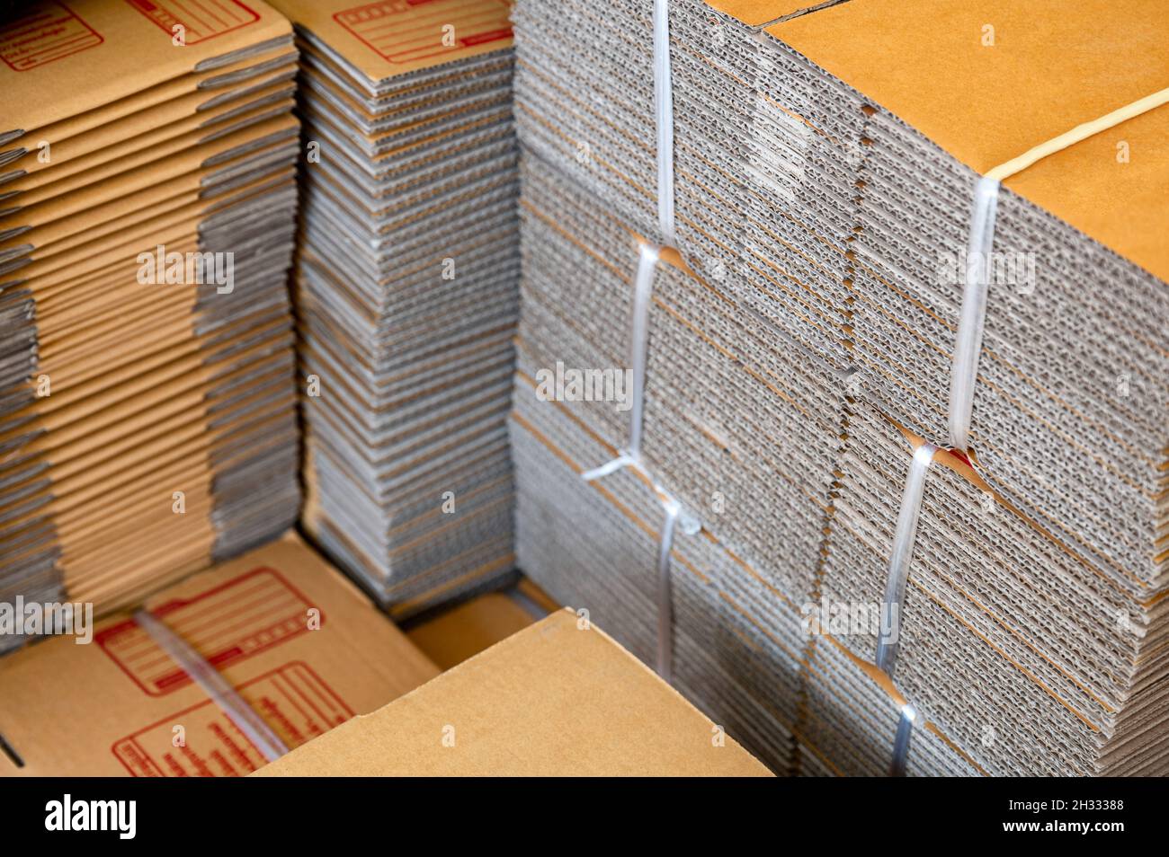 Stack of brown folded cardboard boxes tied for packaging Stock Photo ...