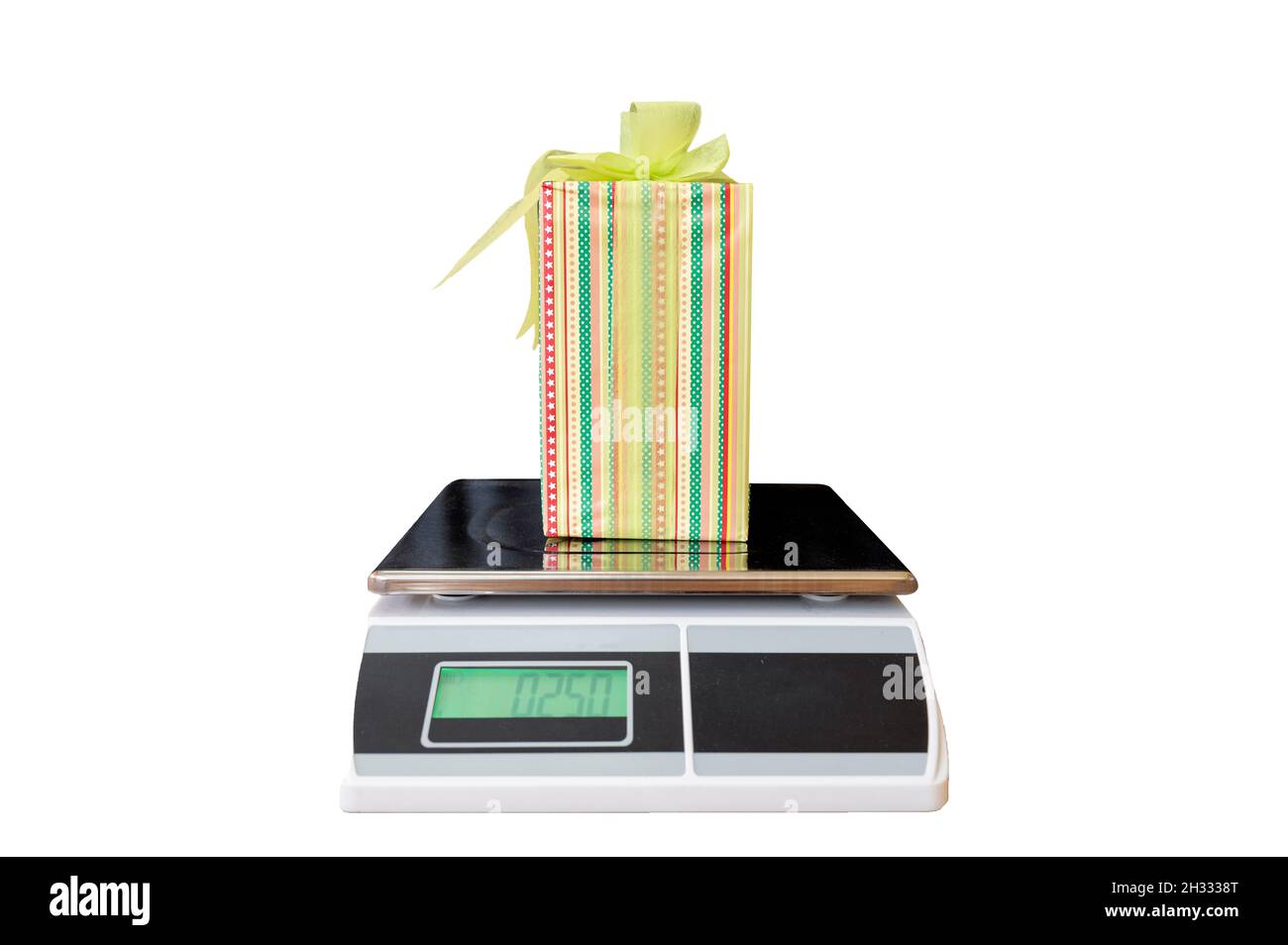 Yellow gift box weigh on digital weight machine. isolated on white ...