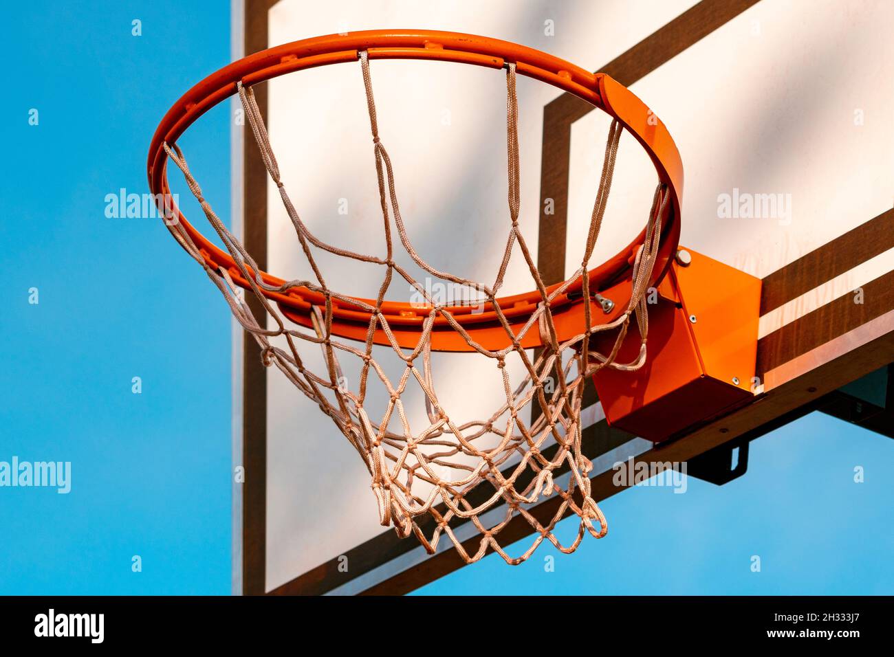 Basketball hoop close up on blue sky background in outdoor basketball ...