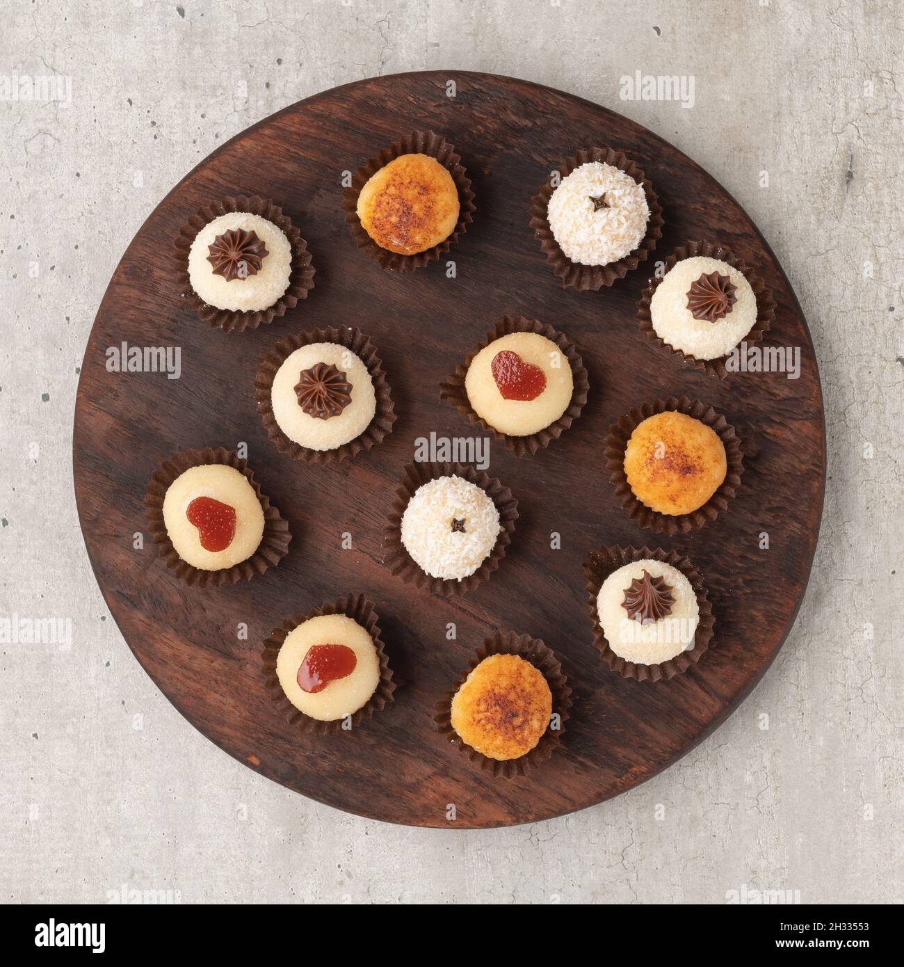 Typical gourmet brazilian brigadeiros, various flavors over wooden ...