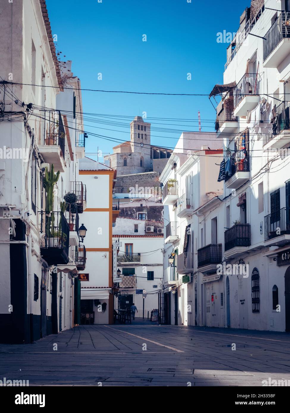 IBIZA, SPAIN - Oct 14, 2020: A vertical shot of an empty road with old ...