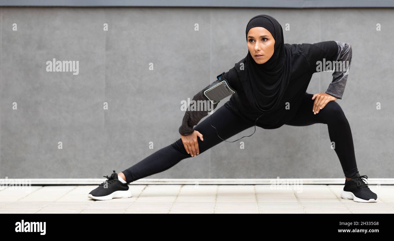 Sport Motivation. Athletic Muslim Lady In Modest Sportswear Stretching ...