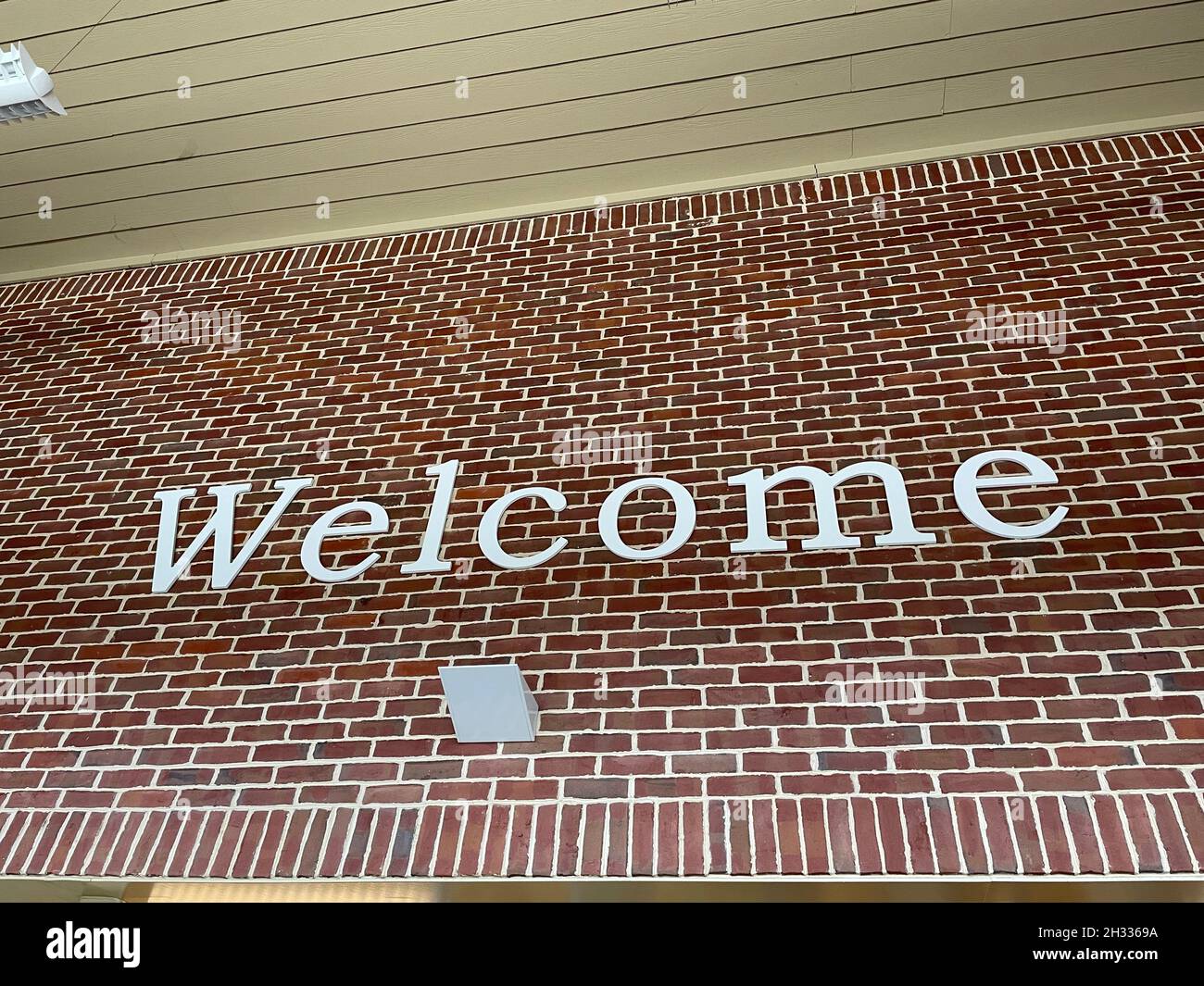 Welcome letters spelled on a brick wall Stock Photo - Alamy