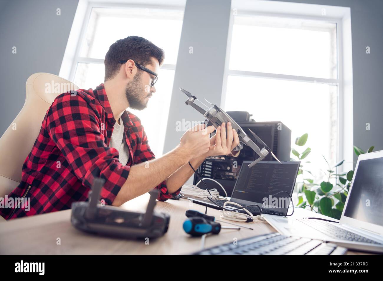 Profile side view portrait of attractive clever focused guy fixing ...