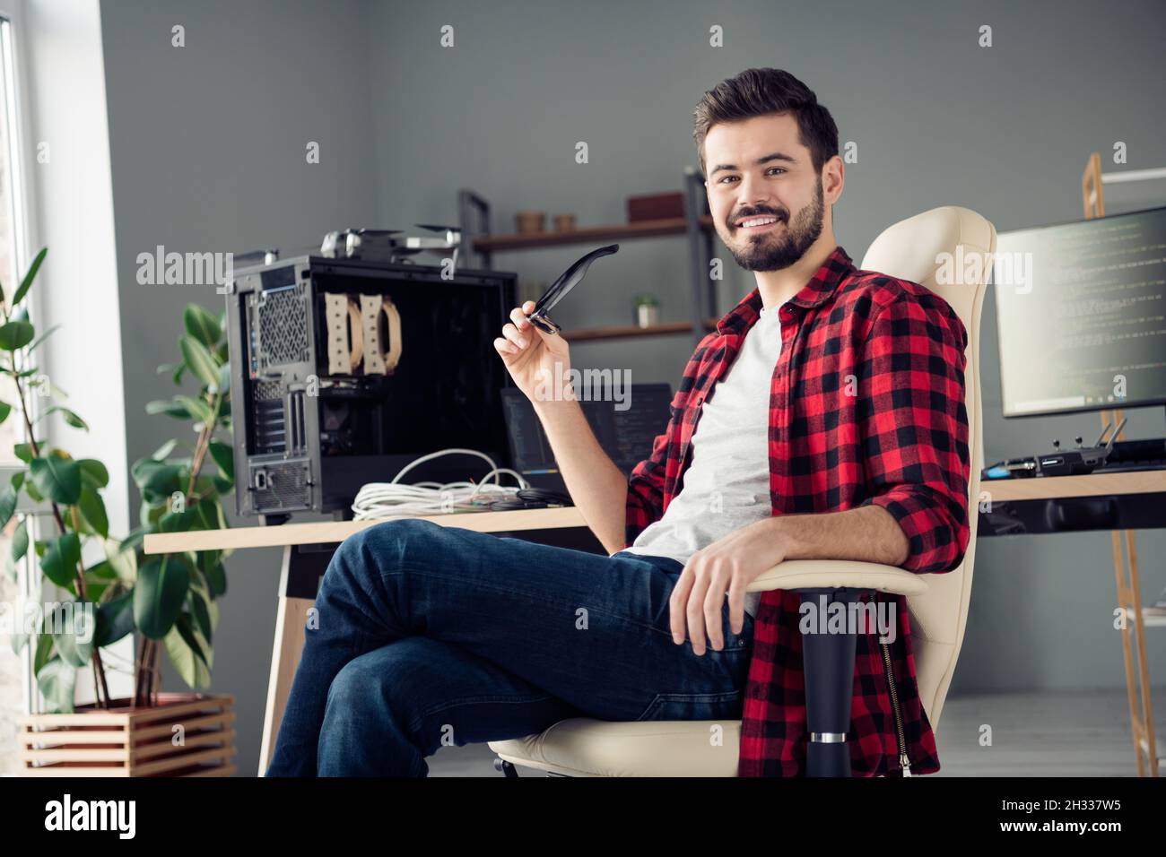 Portrait of attractive intellectual cheerful guy hacker top company ...