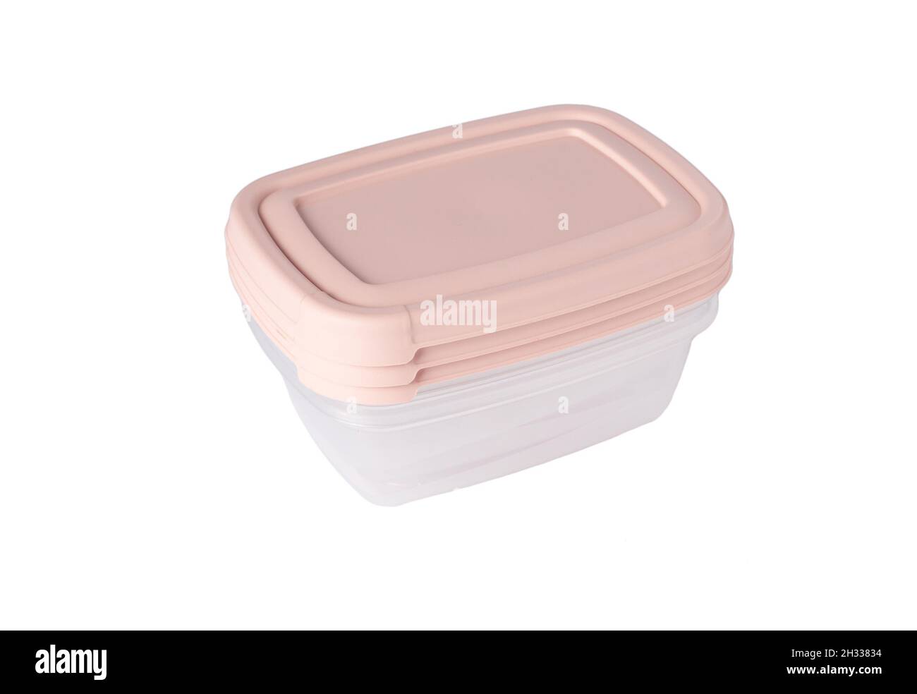 Stack of plastic food storage containers with pink lid isolated on ...