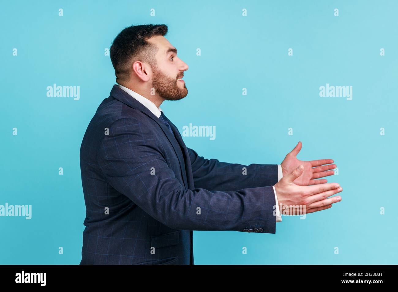Side view of open hearted generous man with beard wearing official ...