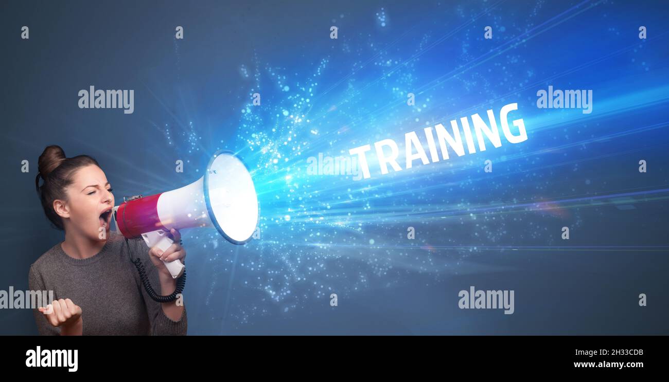 Young person shouting in loudspeaker Stock Photo - Alamy