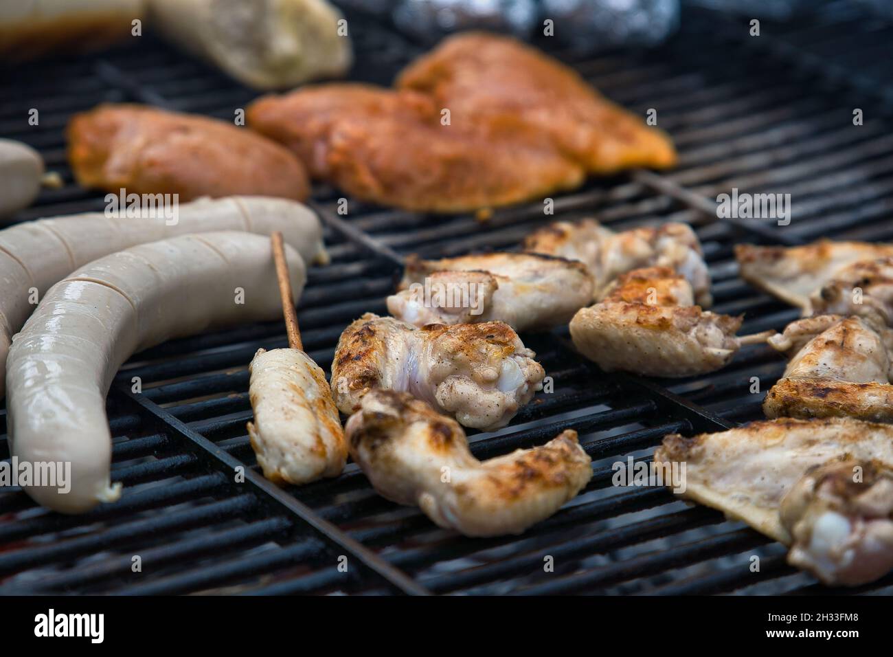 Meat assortment on the barbecue grill Stock Photo - Alamy