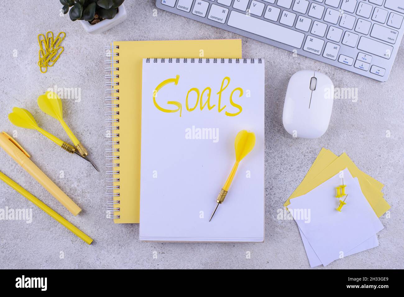 Target and goal concept with arrows and notebook Stock Photo - Alamy