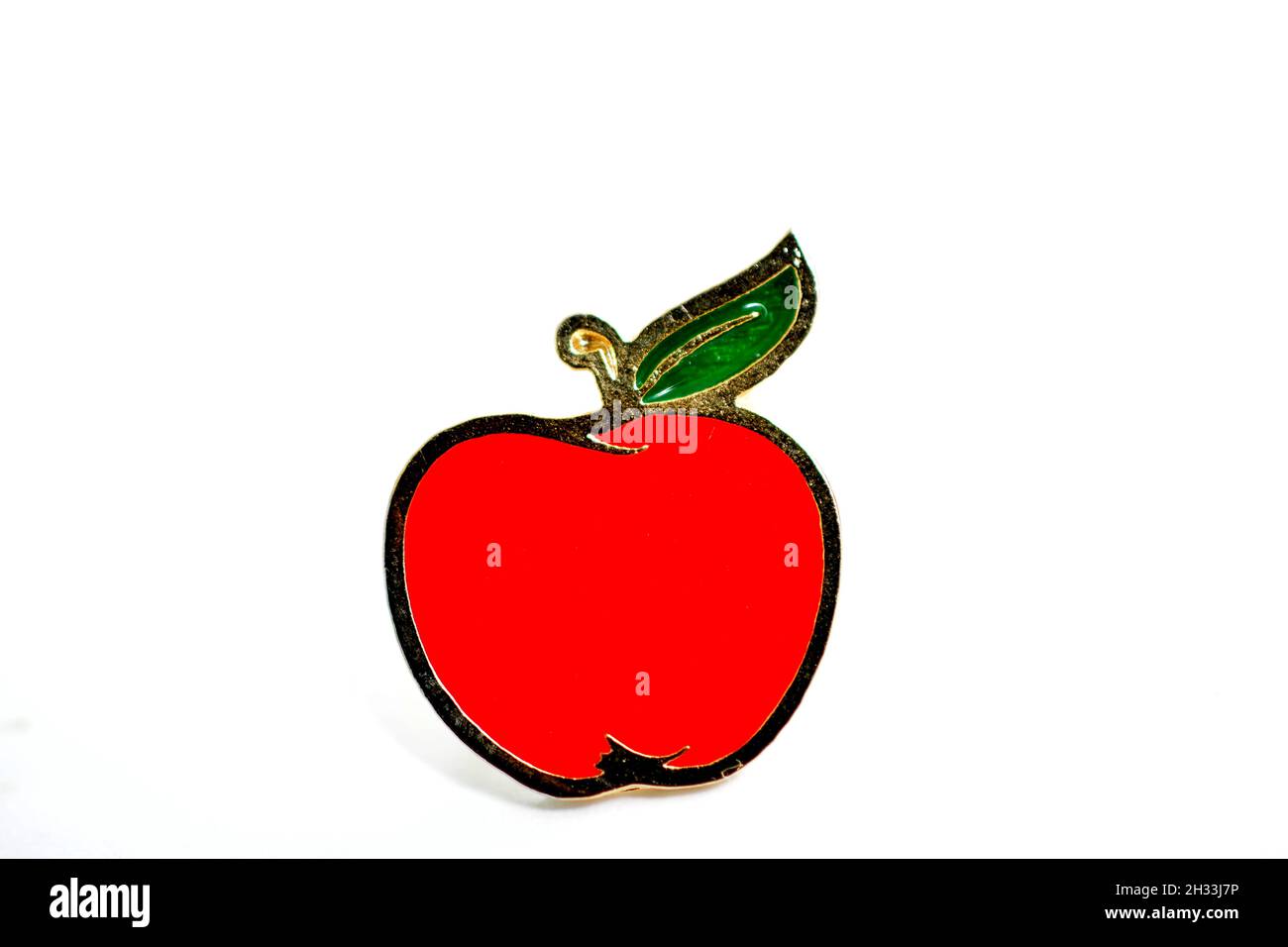 Red apple pin badge on white background Stock Photo - Alamy