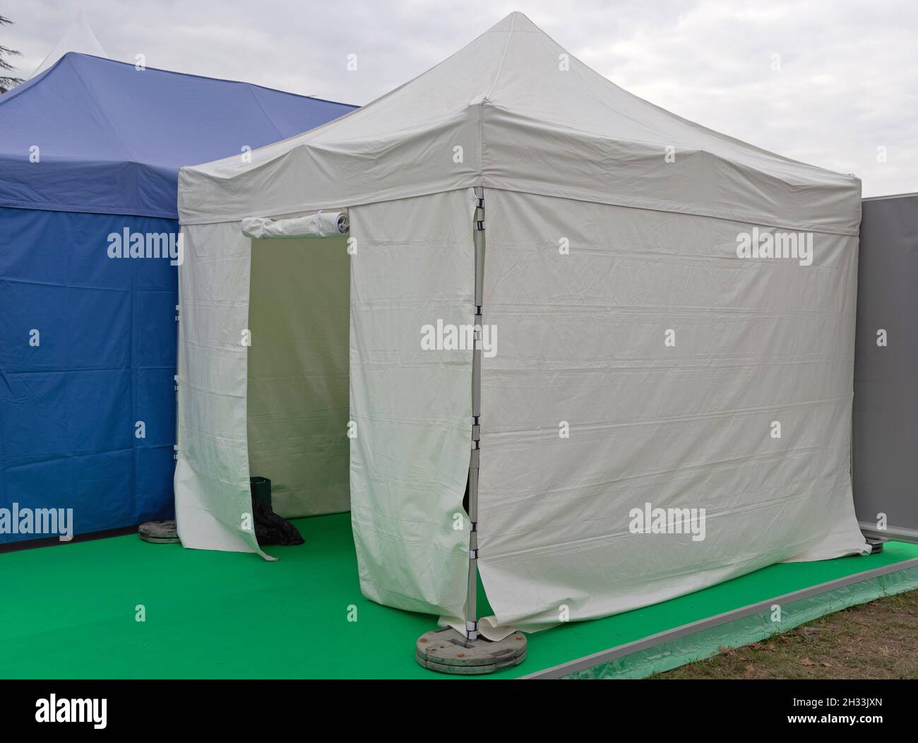 White Tent Canopy Setup For Outdoor Events Stock Photo - Alamy