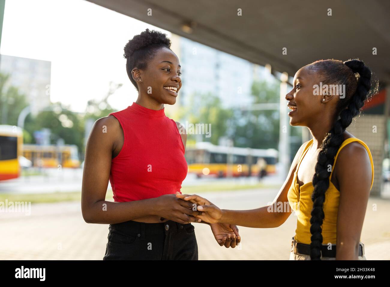 Two girlfriends having fun in the city Stock Photo - Alamy