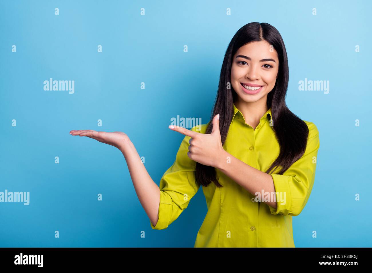 Photo of young girl happy positive smile point finger promo product ...