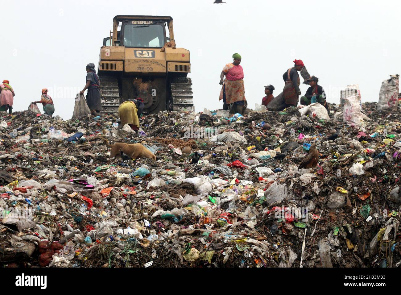 People waste pickers pick the non- biodegradable waste to be used for ...