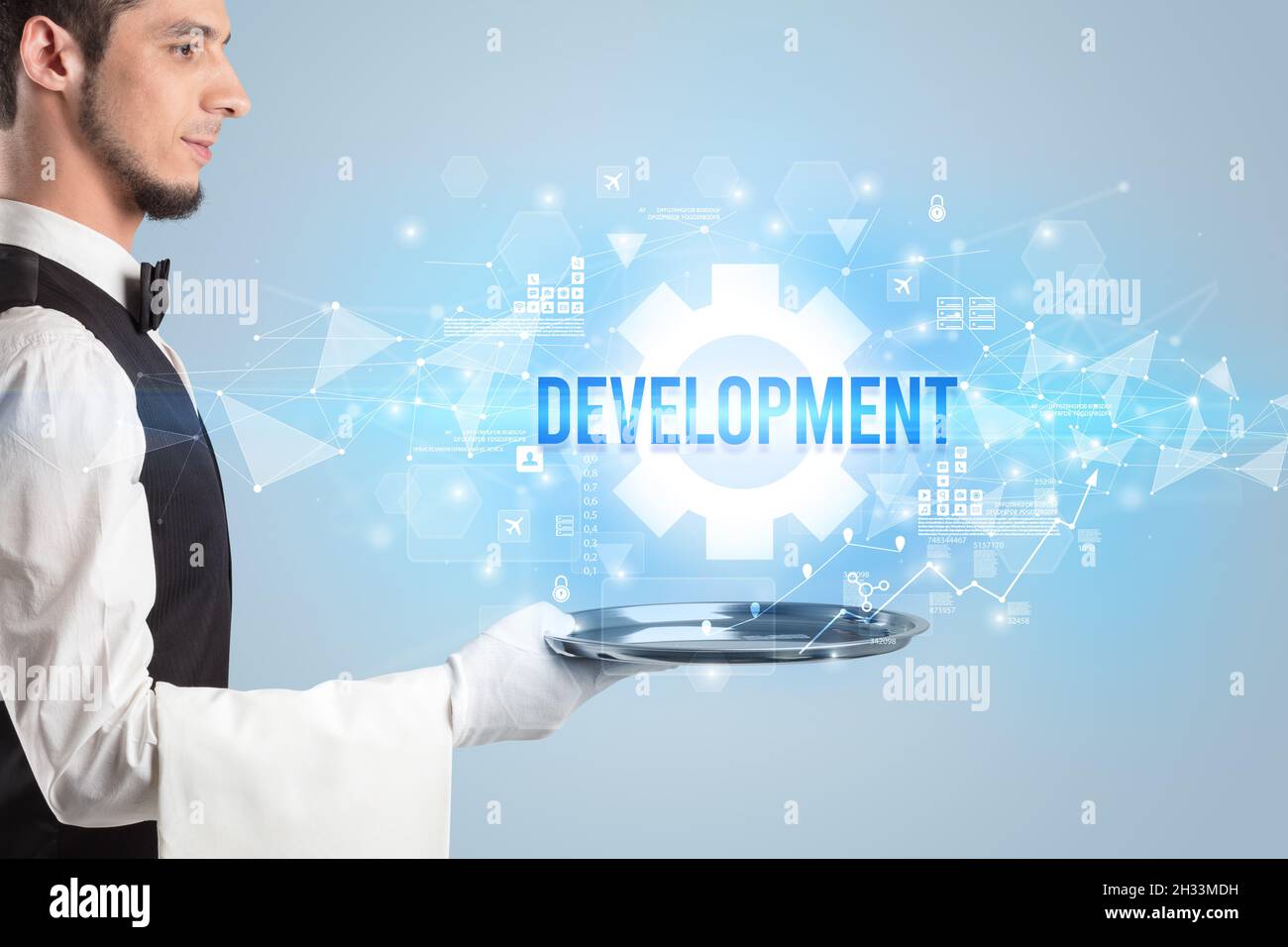 Waiter serving new technology concept Stock Photo - Alamy