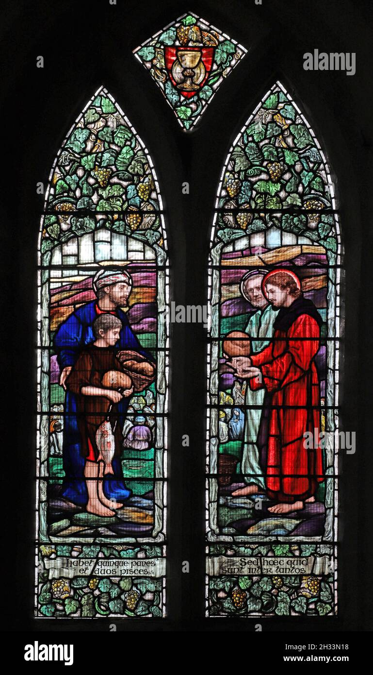 A stained glass window by Mary Lowndes depicting Christ feeding the ...