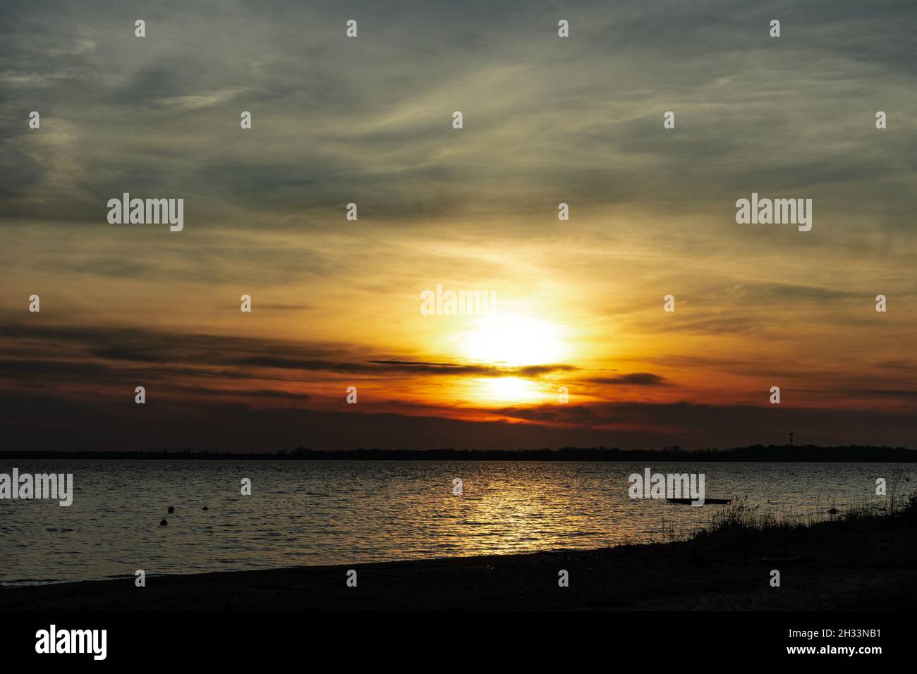 Sunset Over The Lake Stock Photo - Alamy