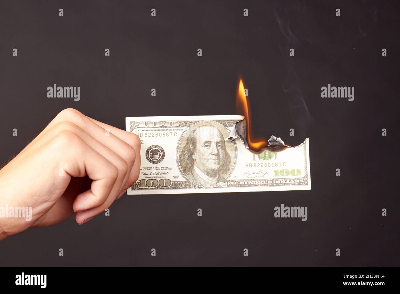 Burning one hundred dollar bill hi-res stock photography and images - Alamy