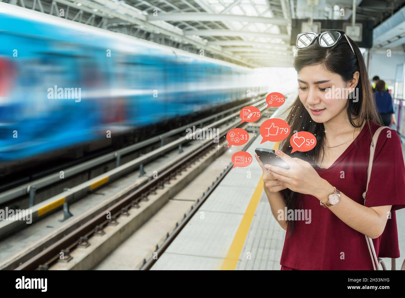 Asian woman passenger using mobile phone to check social network ...
